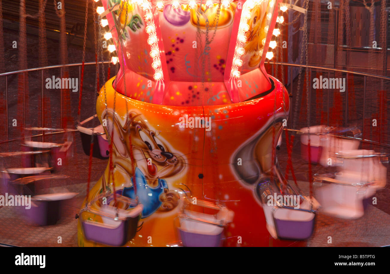 Empty fairground ride at night Stock Photo - Alamy