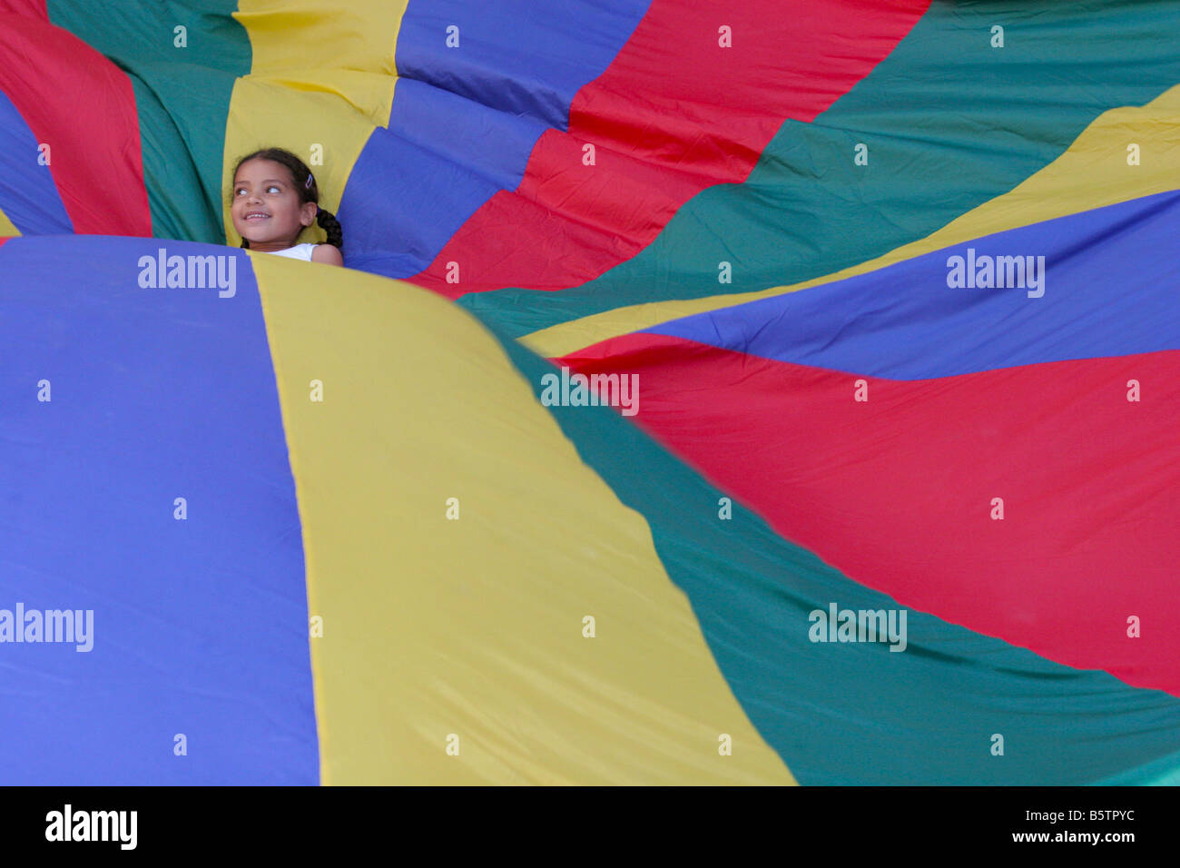 Child in a parachute Stock Photo - Alamy