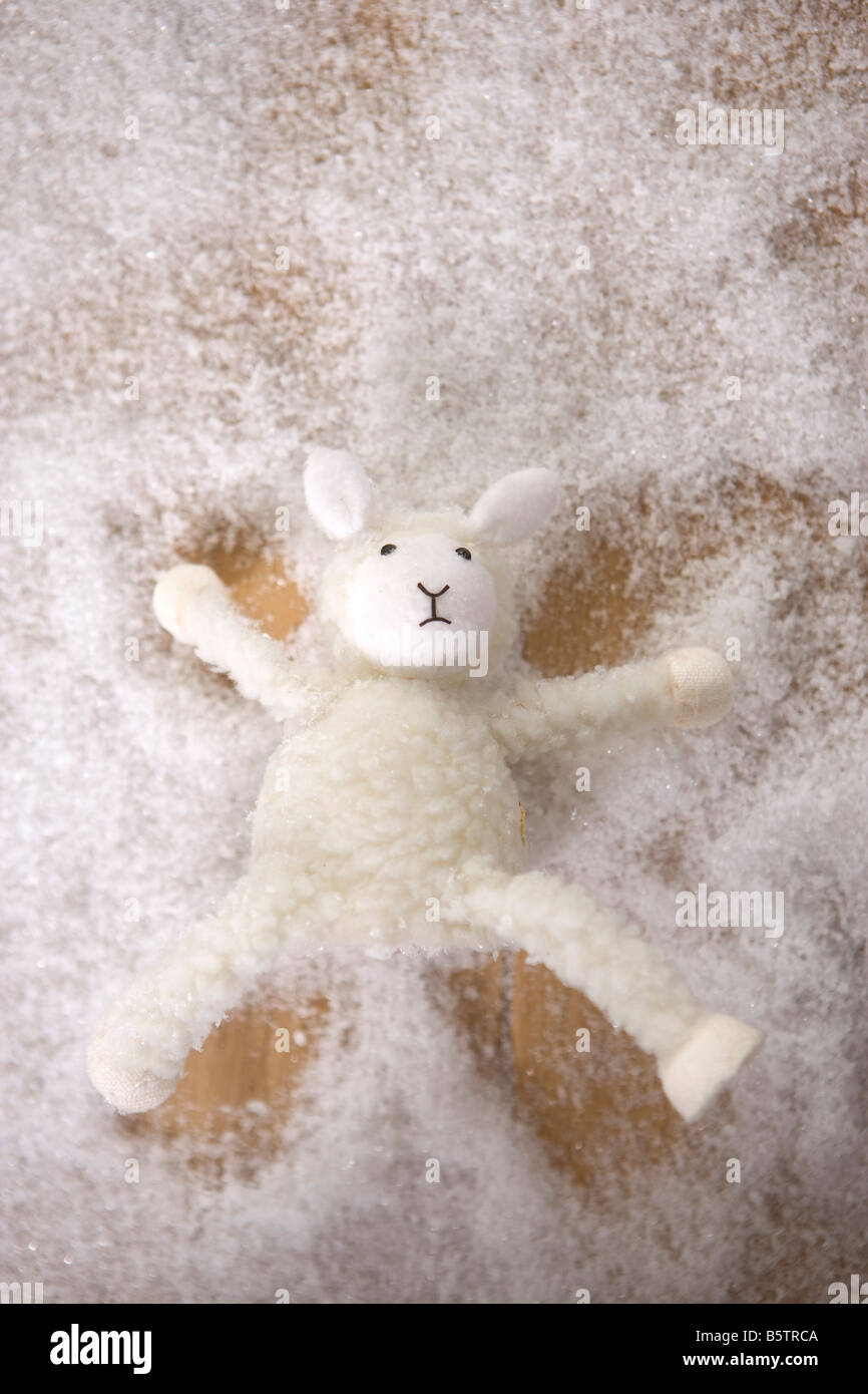 toy sheep making snow angel Stock Photo - Alamy