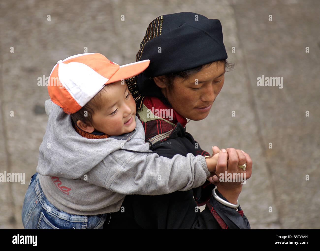 Child carried hi-res stock photography and images - Alamy