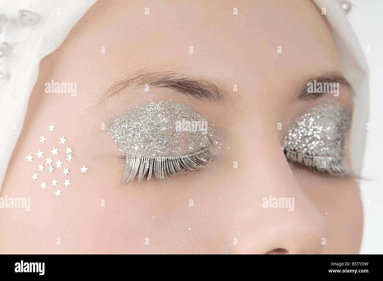 close up on eyes with silver make up and silver eyelashes Stock Photo ...