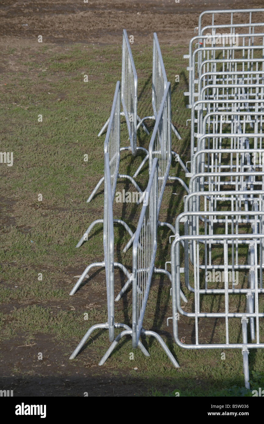 rows of many metal crowd control barriers gates in field Stock Photo ...
