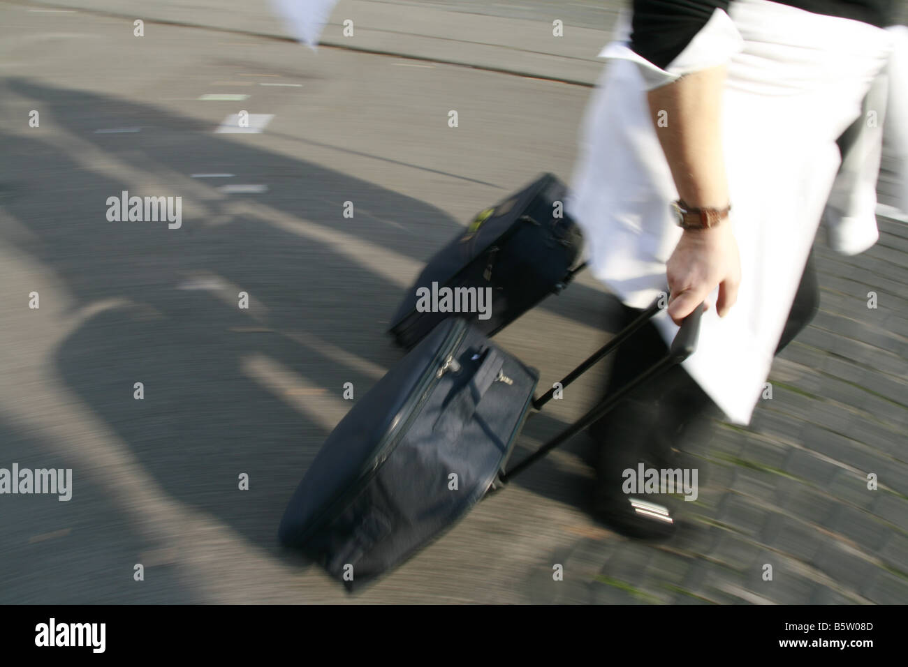 Man in hurry pulling suitcase baggage luggage hi-res stock photography ...