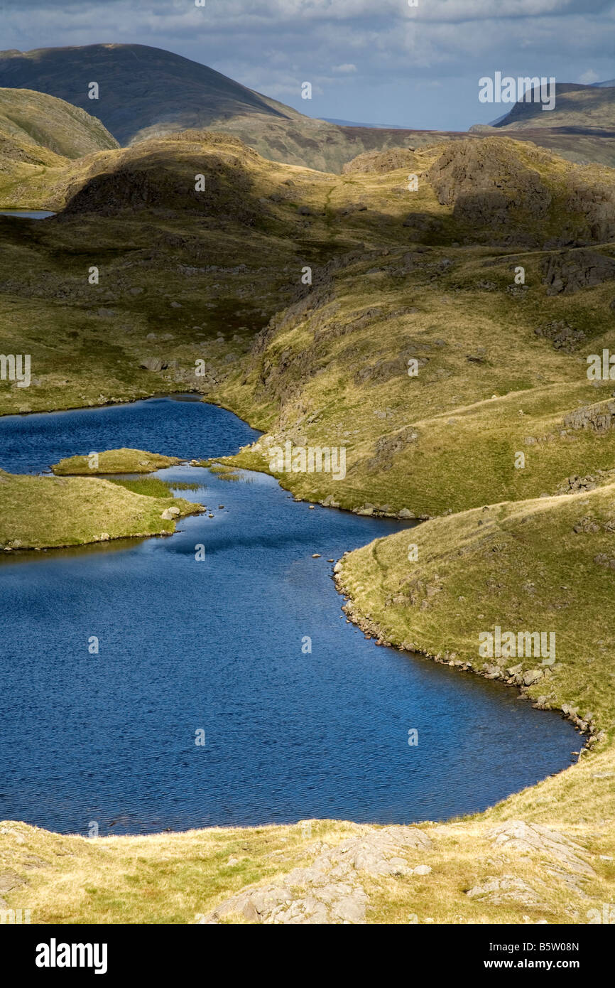 "Seathwaite Fell" and the deep blue waters of "Sprinkling Tarn Stock ...