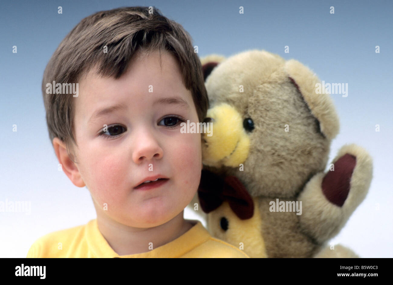 little boy with his teddy bear Stock Photo - Alamy