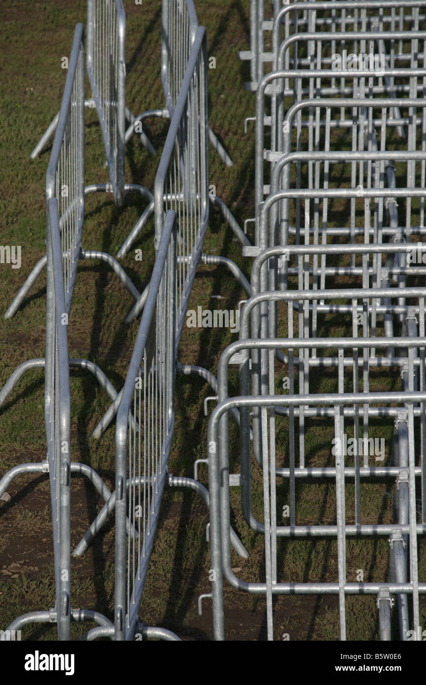rows of many metal crowd control barriers gates in field Stock Photo ...