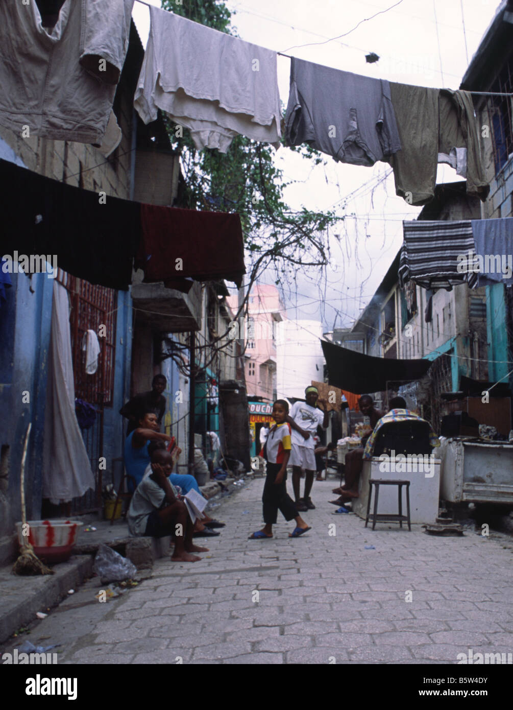 Street life in the middle of a bidonville or slum in Port au Prince ...