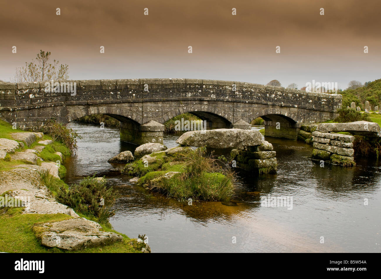 Dramatic view of Bellever Clapper Bridge in Dartmoor National Park ...