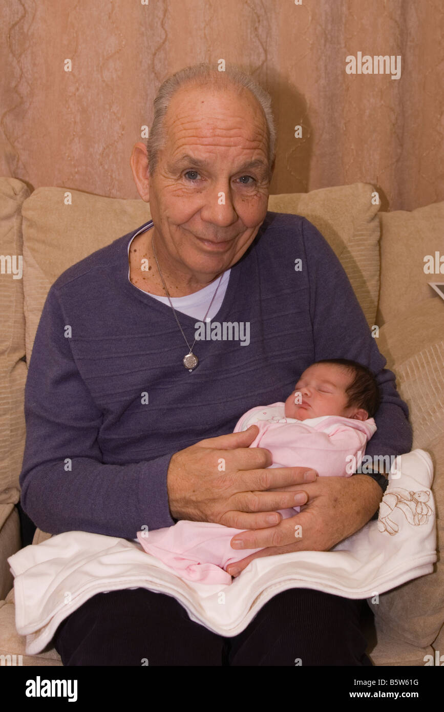 Grandfather Man Person with new born 1 Week Old Grand Daughter Asleep ...