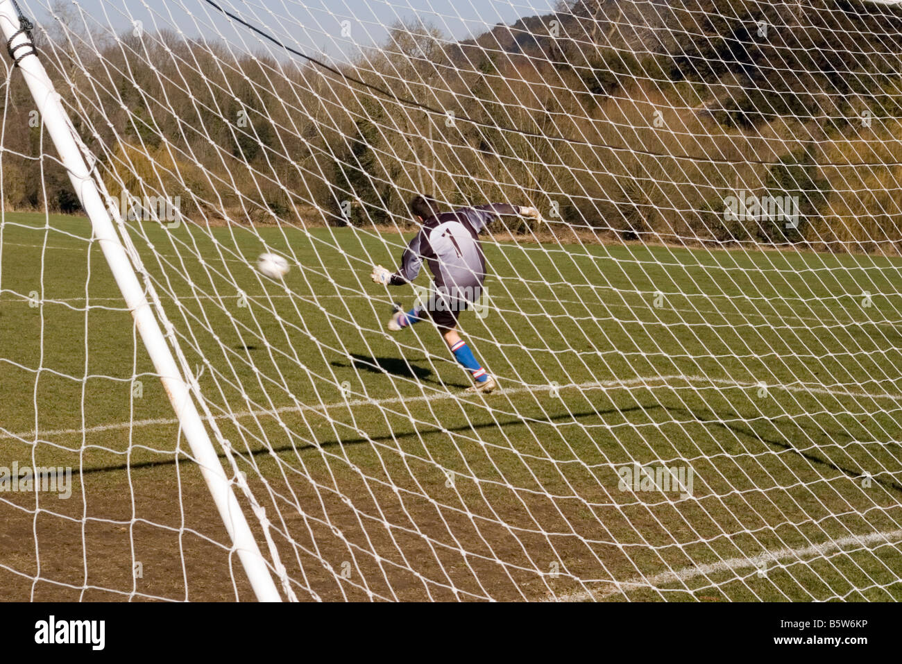 Amateur Football Goalkeeper Taking Goal Kick kicking the Ball Stock ...