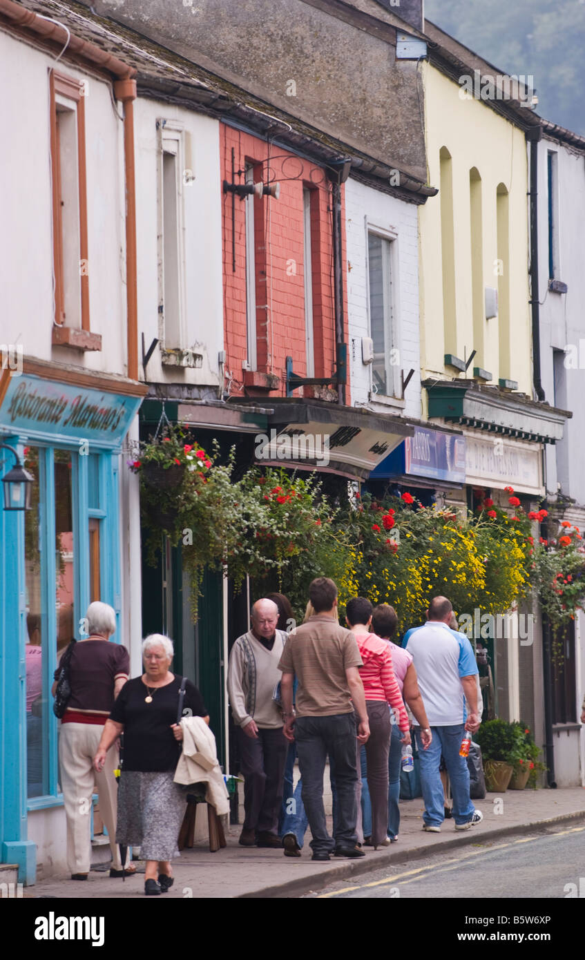 People walking past row of shops in small market town UK Stock Photo ...