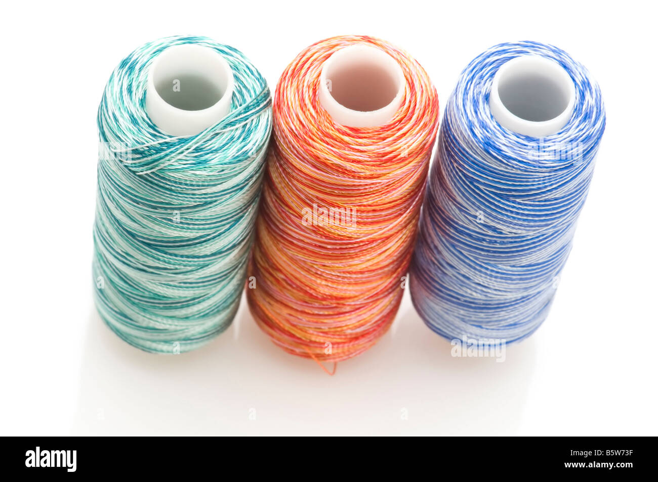object on white tool Multicolored sewing rolls Stock Photo - Alamy