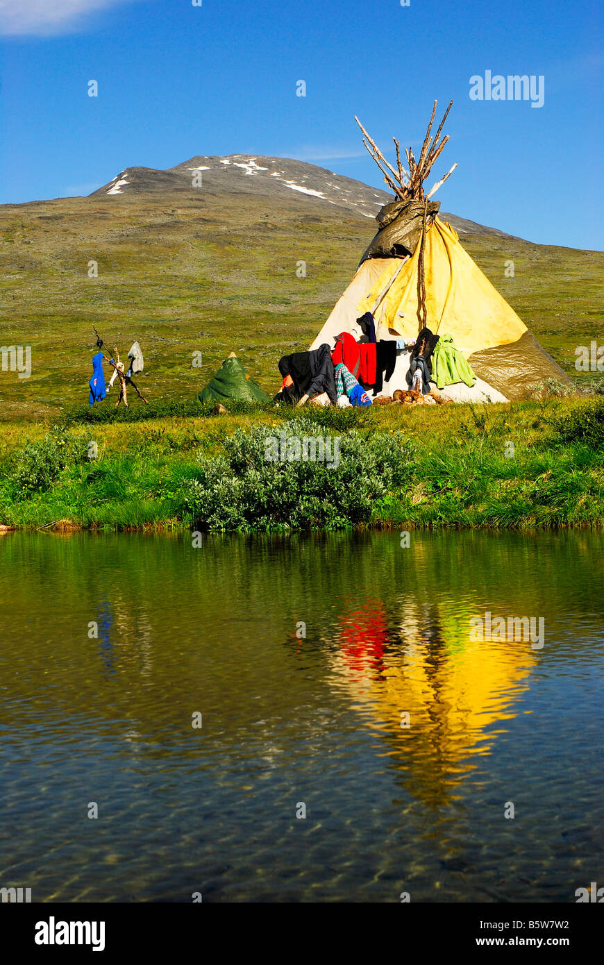 a scaffold of a Sami tent Kote , in background Akkamassif in Stora ...