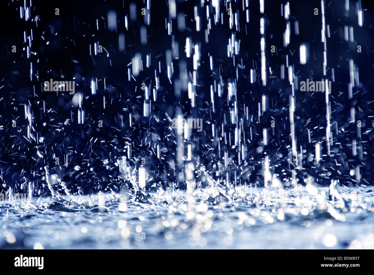 abstract many water drops falling on ground floor Stock Photo - Alamy