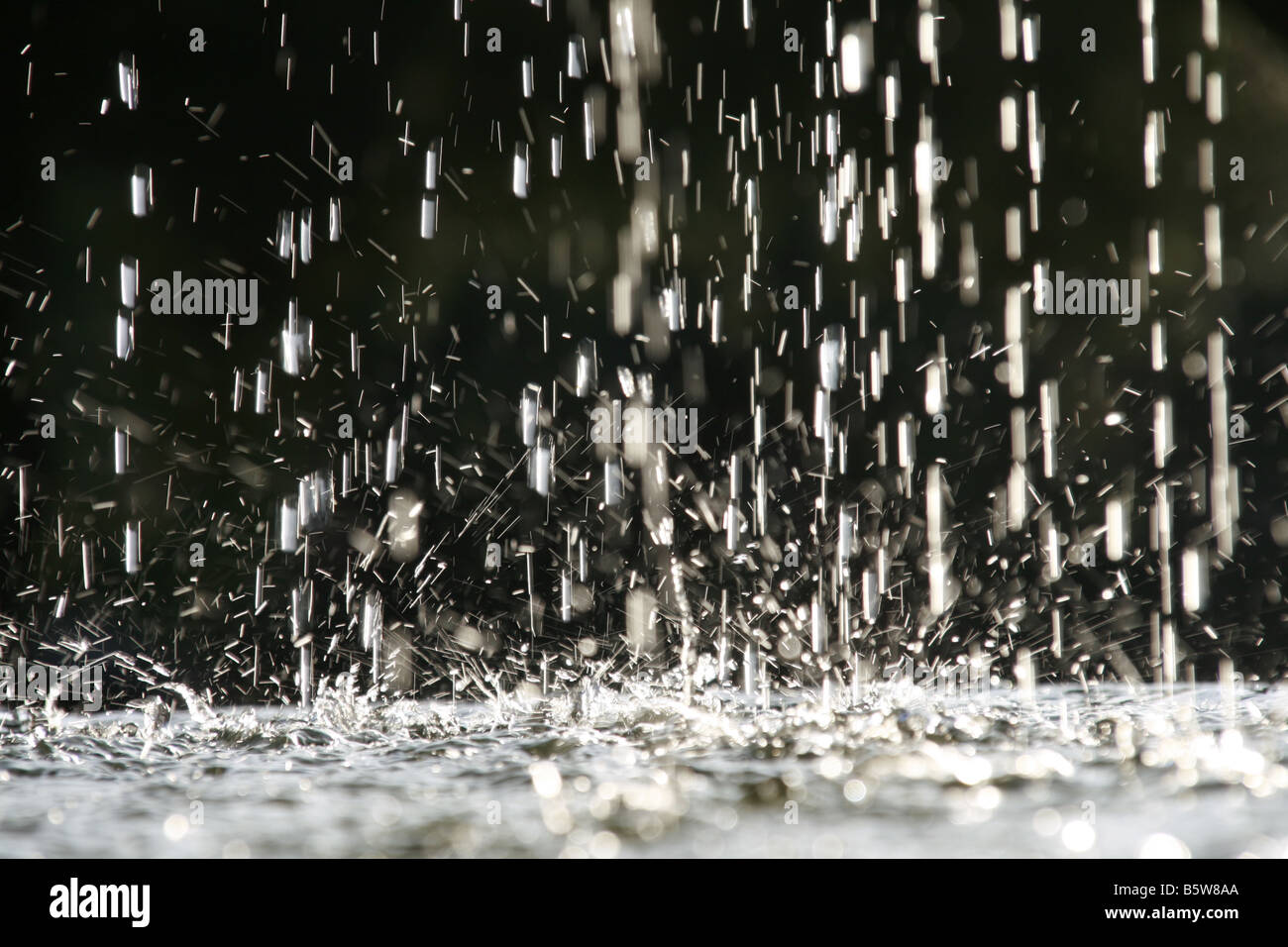 abstract many water drops falling on ground floor Stock Photo - Alamy