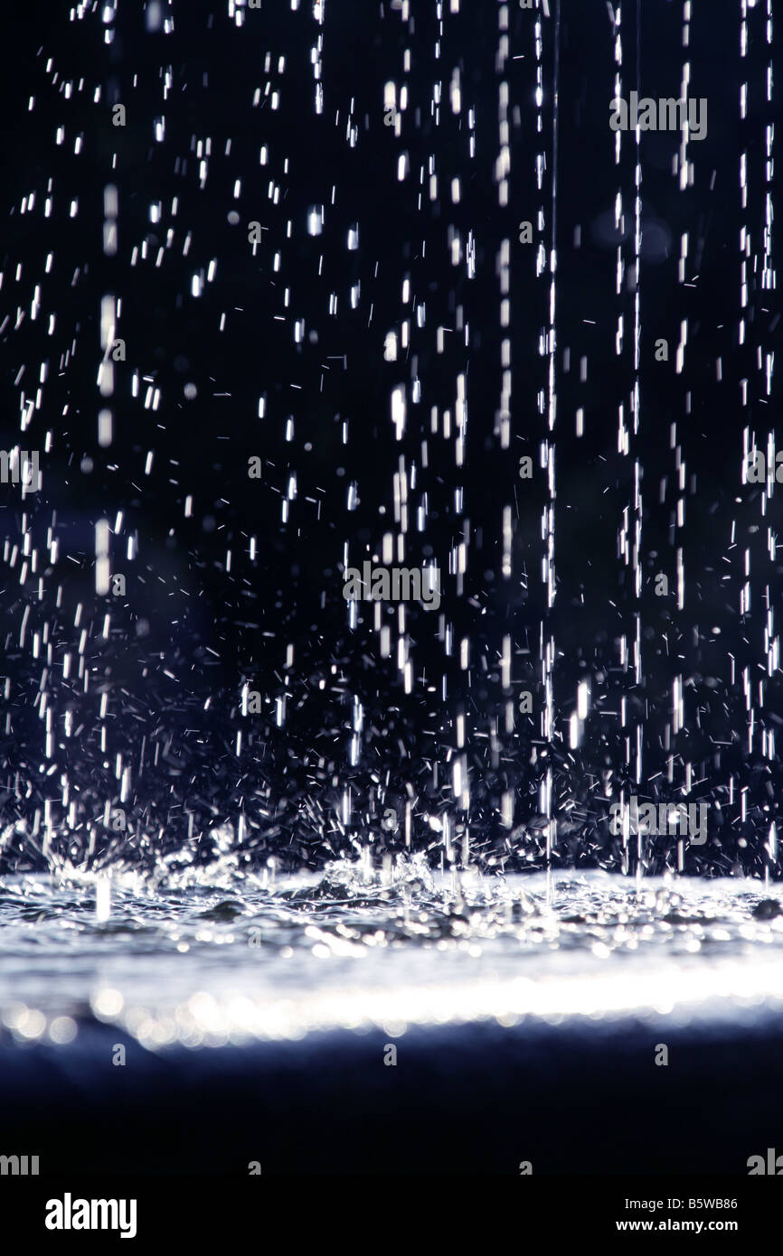 abstract many water drops falling on ground floor Stock Photo - Alamy