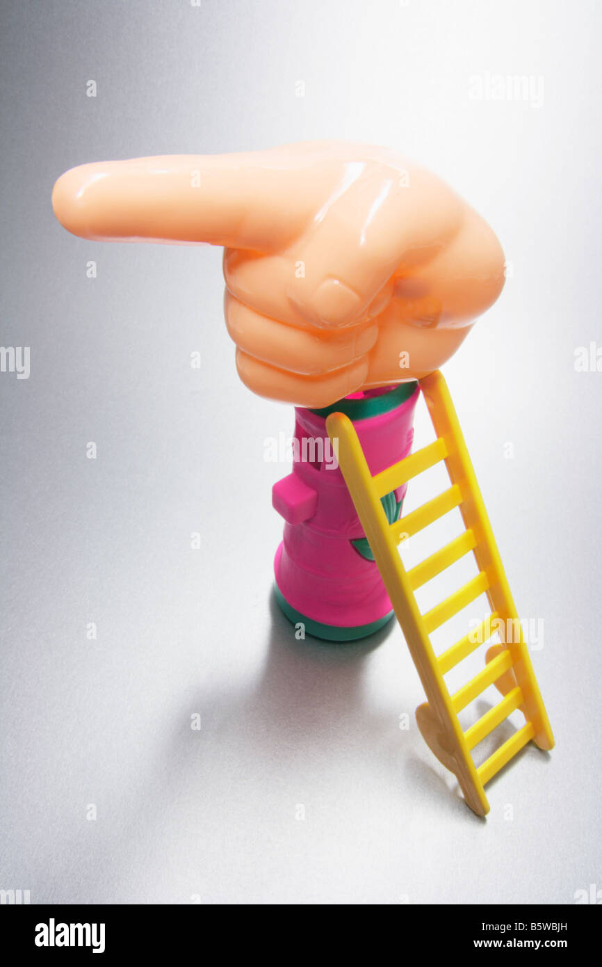Plastic Hand and Miniature Ladder Stock Photo - Alamy