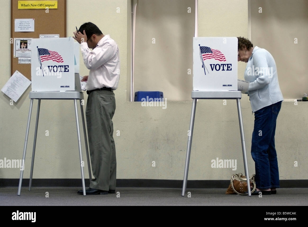 Young man and elderly woman voting at a Polling Place in San Jose, CA ...