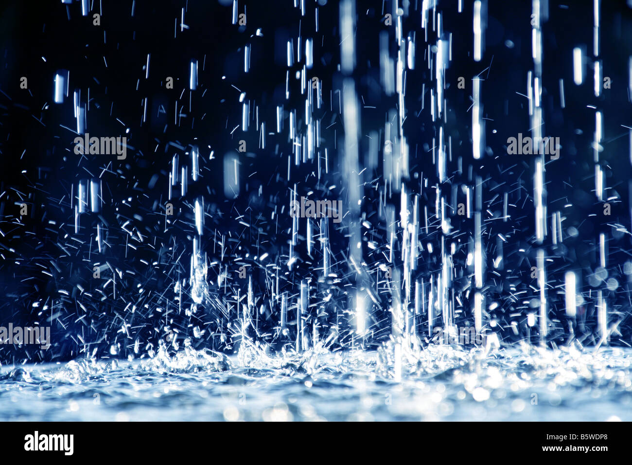 abstract many water drops falling on ground floor Stock Photo - Alamy