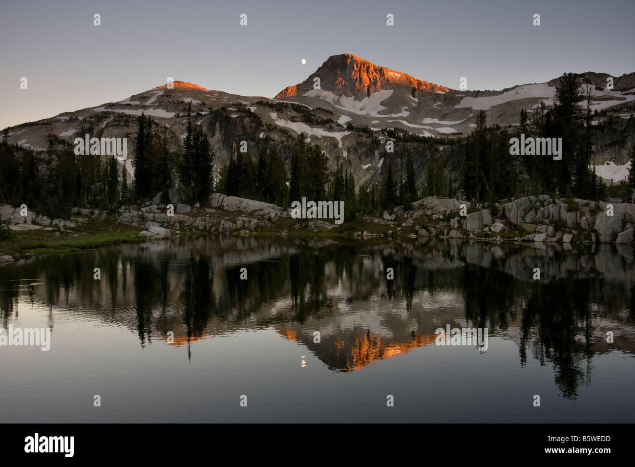 Evening light on Eagle Cap Peak reflected in Sunshine Lake with the ...
