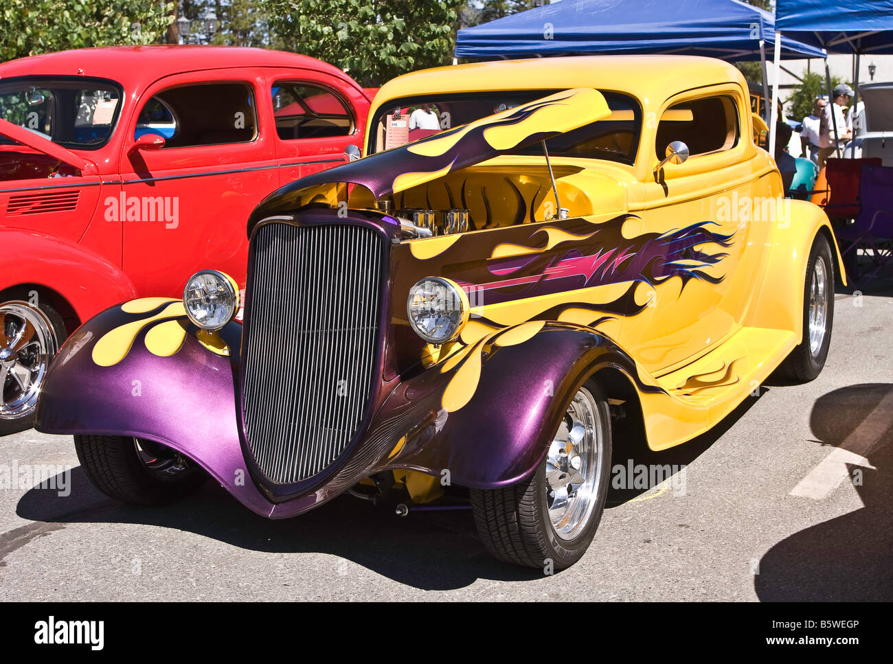 Yellow with purple flames two door V8 hot rod coupe Stock Photo - Alamy