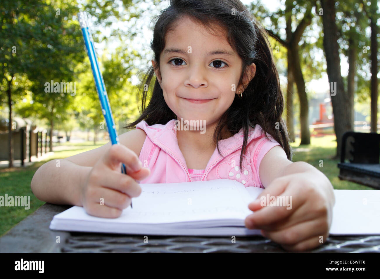 A young girl pratices writing letters Stock Photo - Alamy