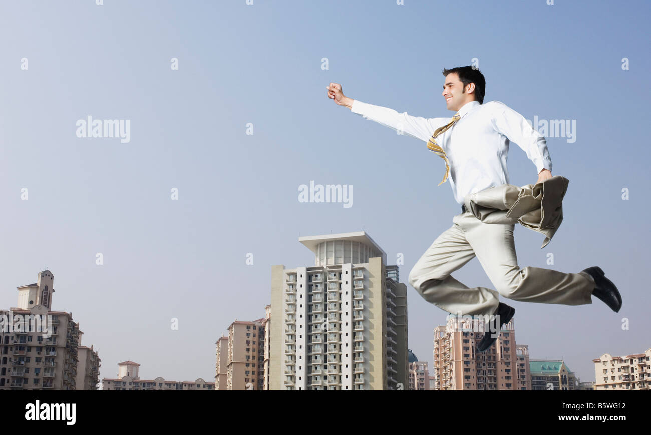 Businessman flying with his arms outstretched Stock Photo - Alamy