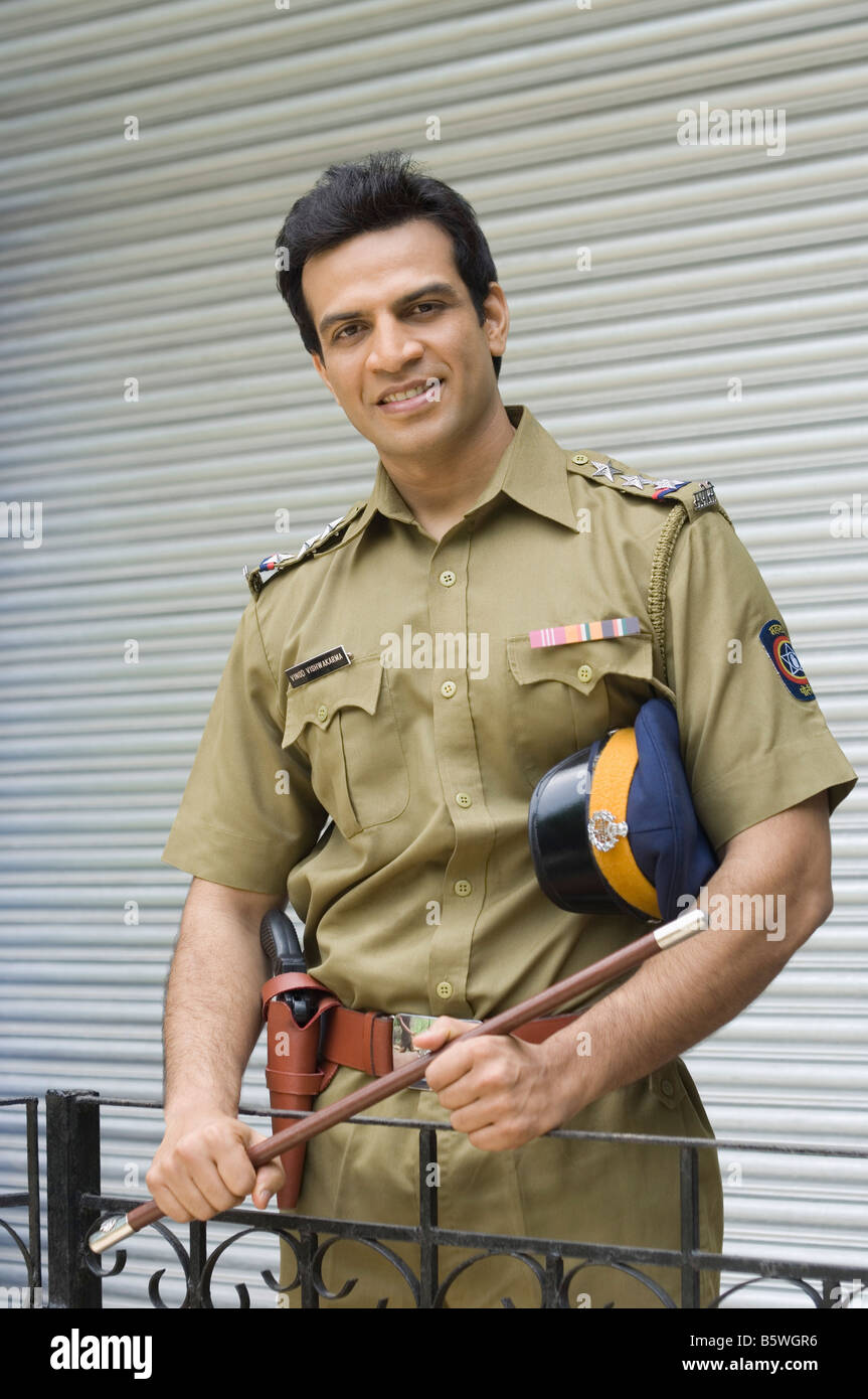 Portrait of a policeman smiling Stock Photo - Alamy