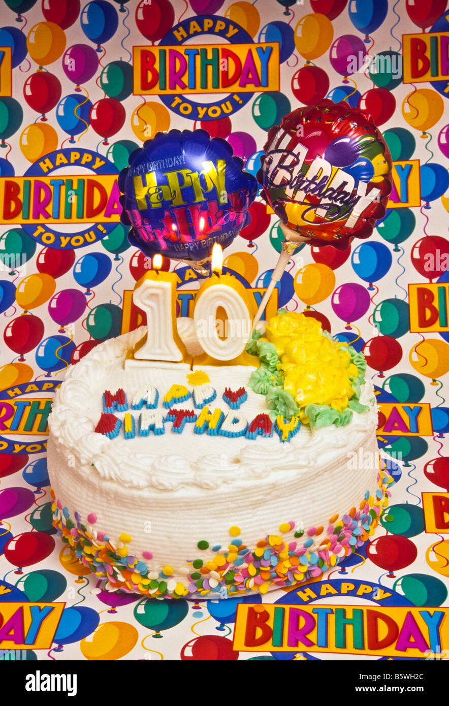 Birthday cake with "ten" candle burning, balloons, ribbons Stock Photo ...