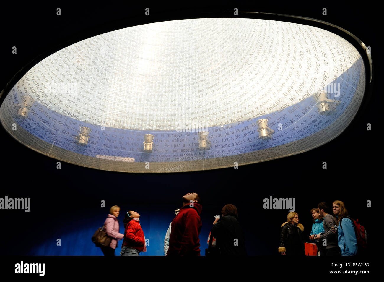 People pay their respects at the memorial for the victims of the Madrid ...