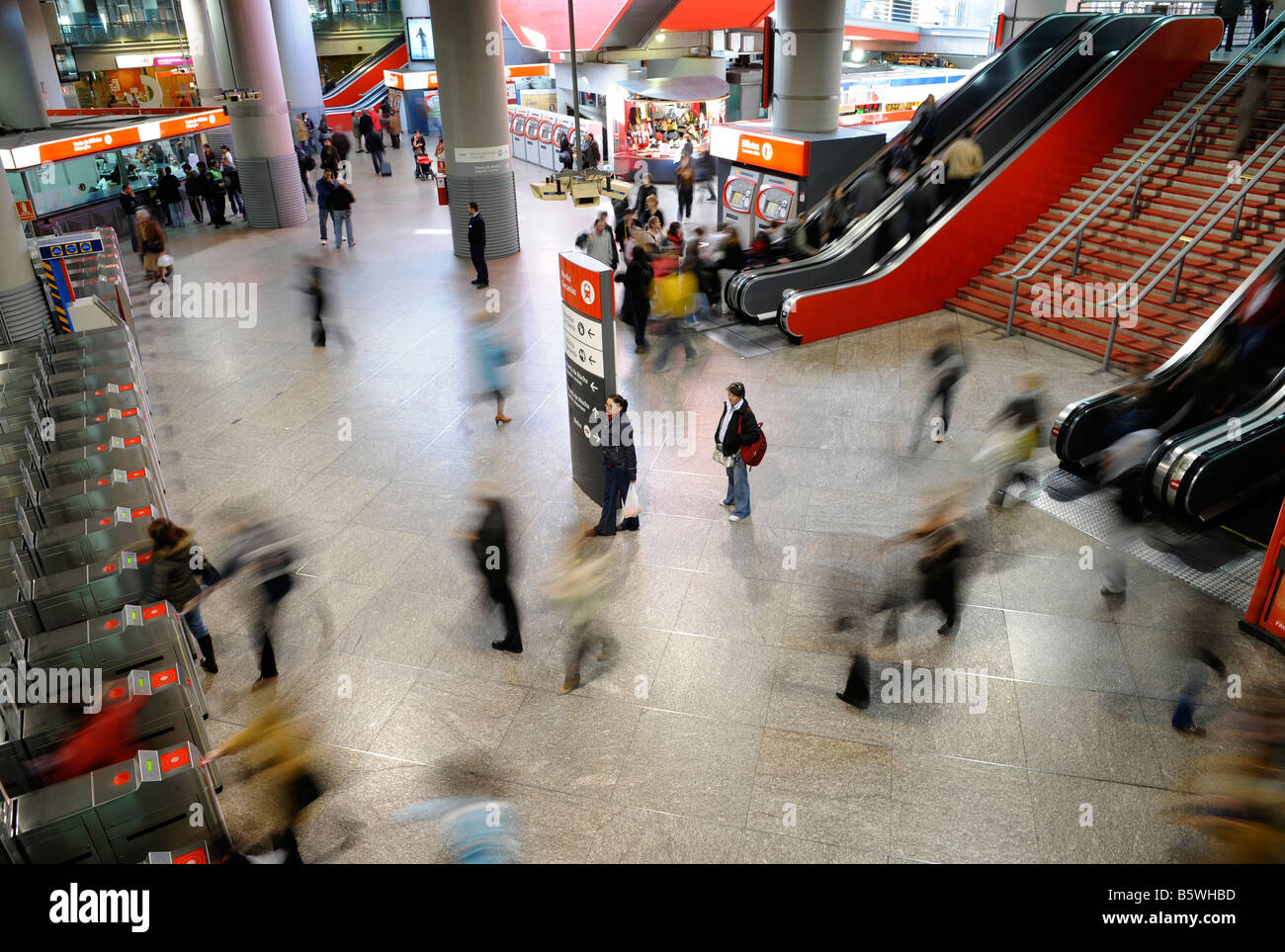 Commuters rush to get their trains during rush hour at Atocha train ...