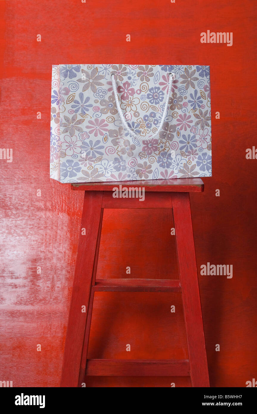 Close-up of a shopping bag on a stool Stock Photo - Alamy