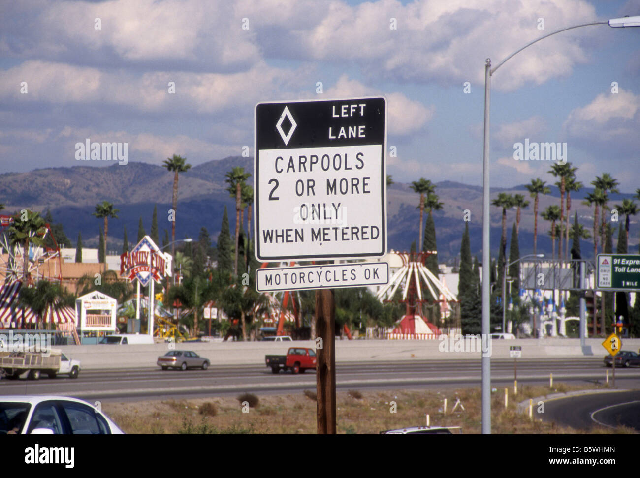 Carpool limit sign on freeway entrance Stock Photo - Alamy