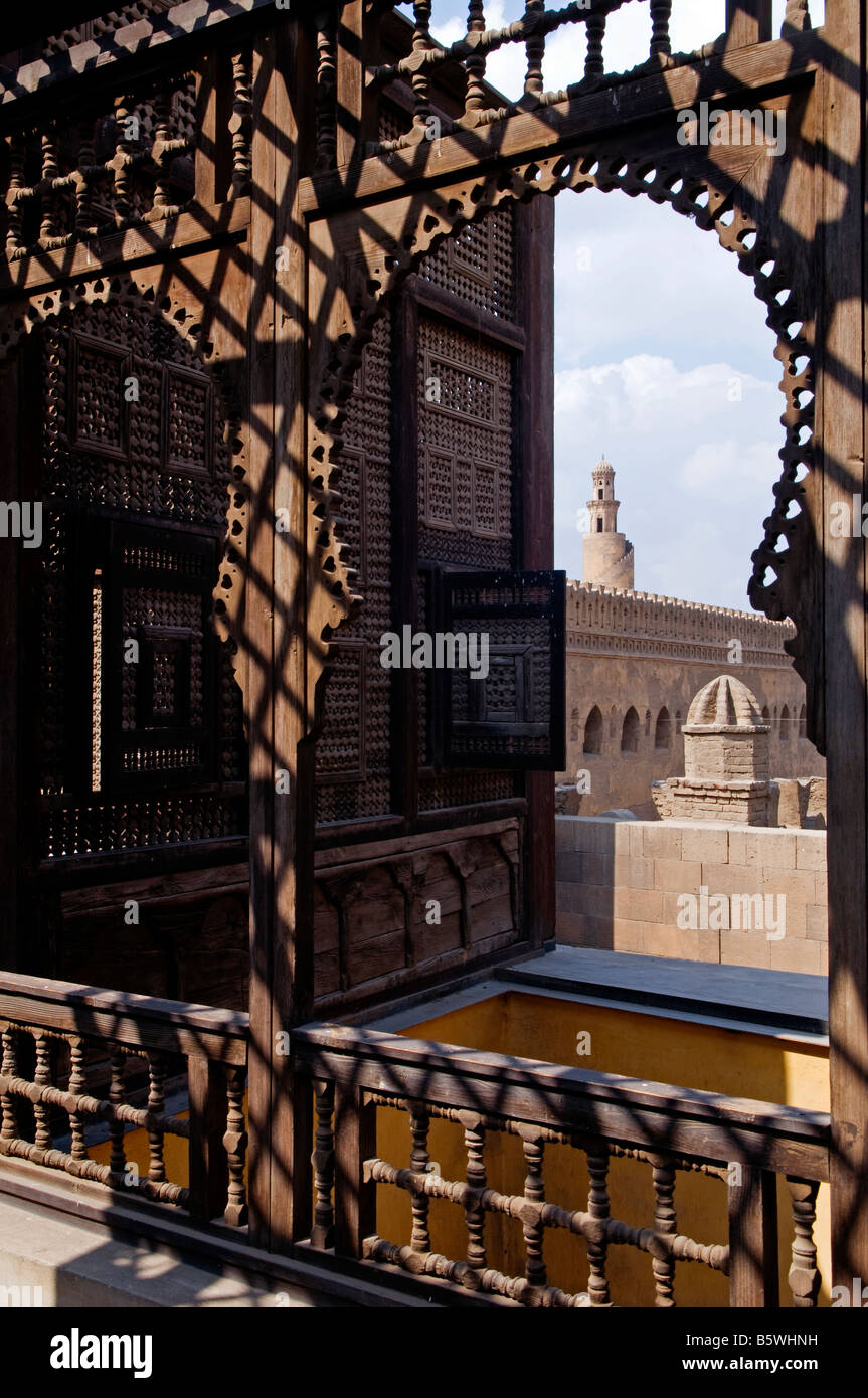 View of Ibn Tulun mosque through carved wood latticework Mashrabiya ...