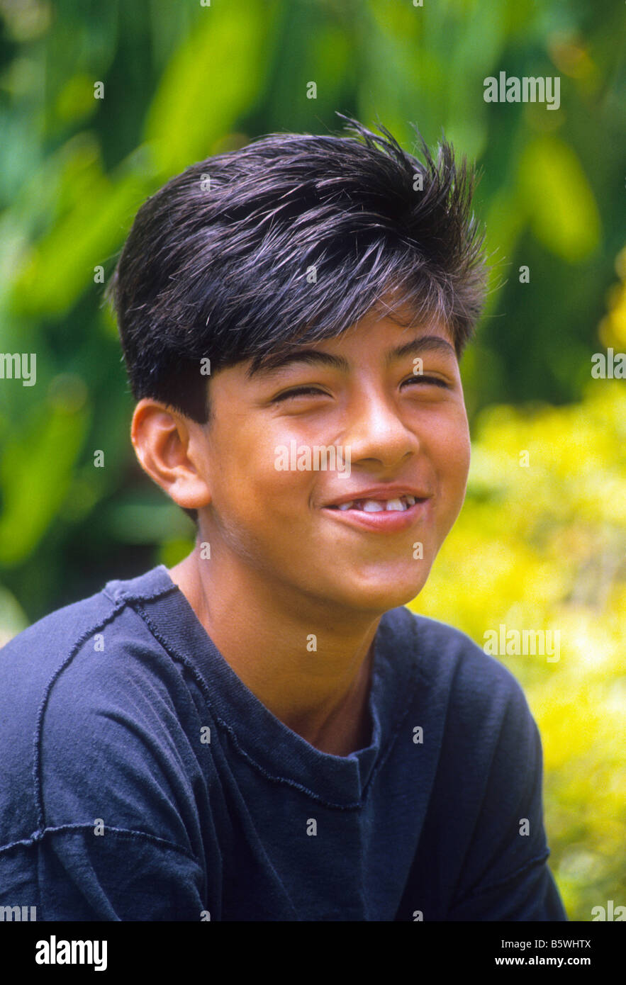 Teen male smirk hispanic hi-res stock photography and images - Alamy