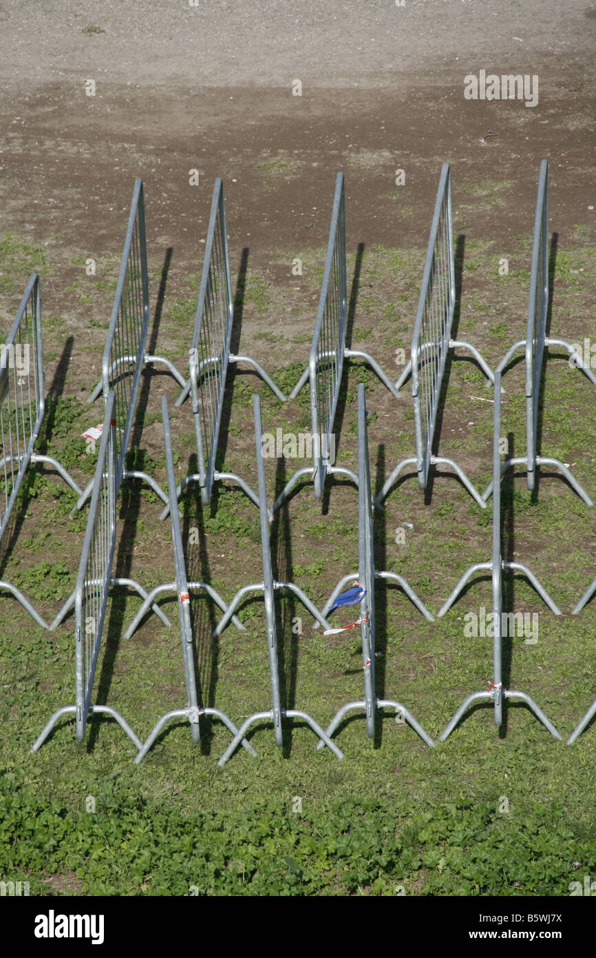 rows of many metal crowd control barriers gates in field Stock Photo ...