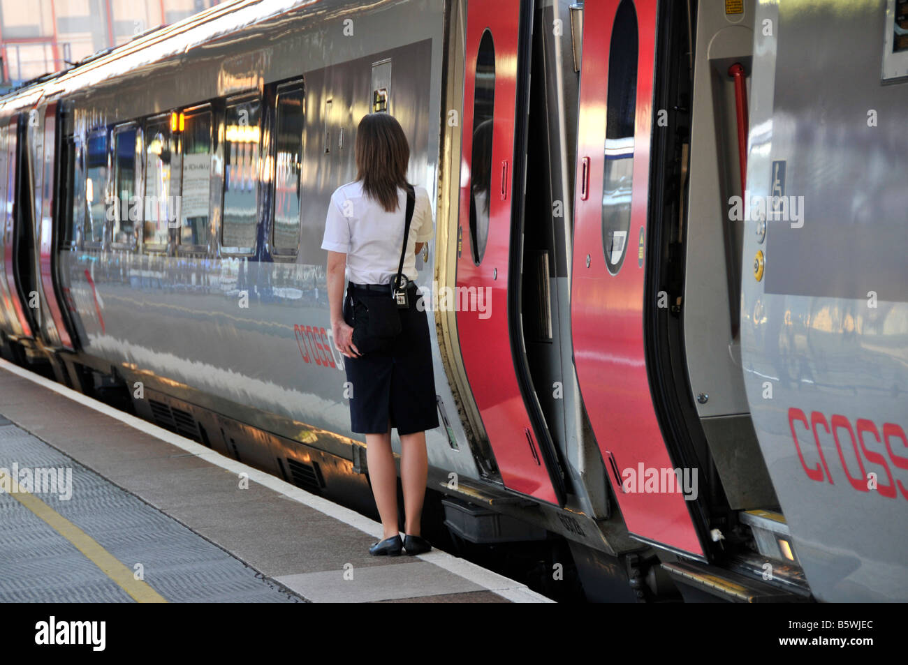 Women train conductor standing on oxford platform Stock Photo - Alamy