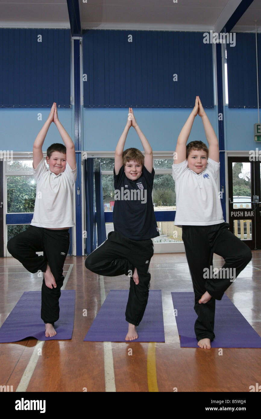 Primary age children in yoga pose at a School in Chelmsford, Essex ...