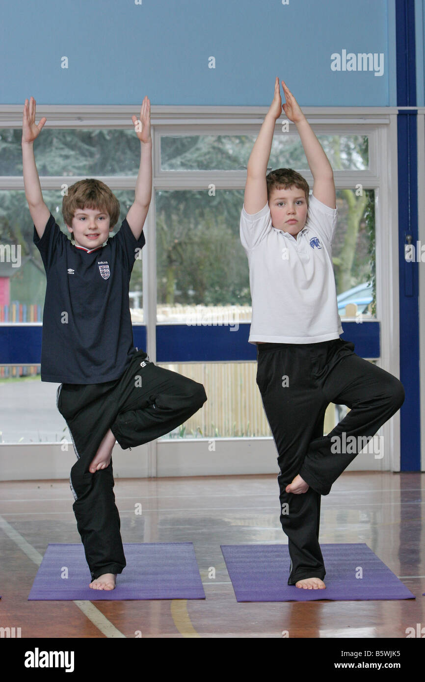 Primary age children in yoga pose at a School in Chelmsford, Essex ...