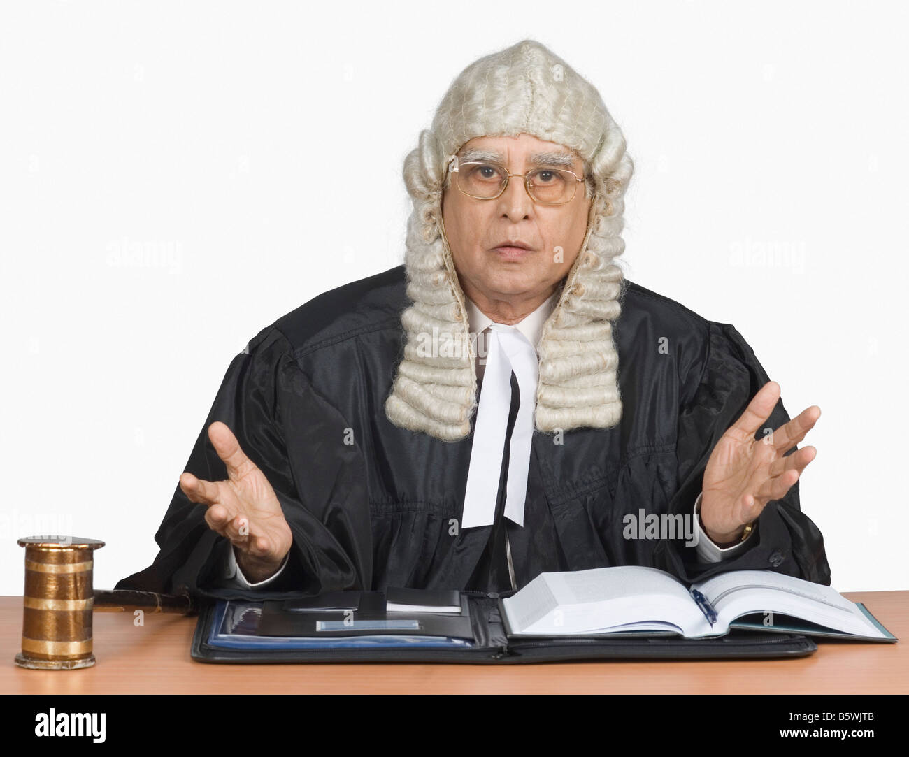 Portrait of a male judge giving judgment Stock Photo - Alamy