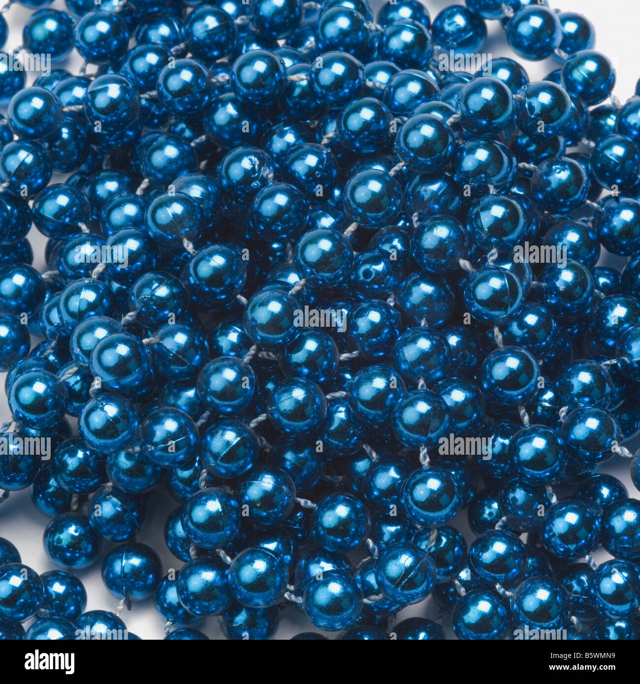 Close-up of string of blue beads Stock Photo - Alamy