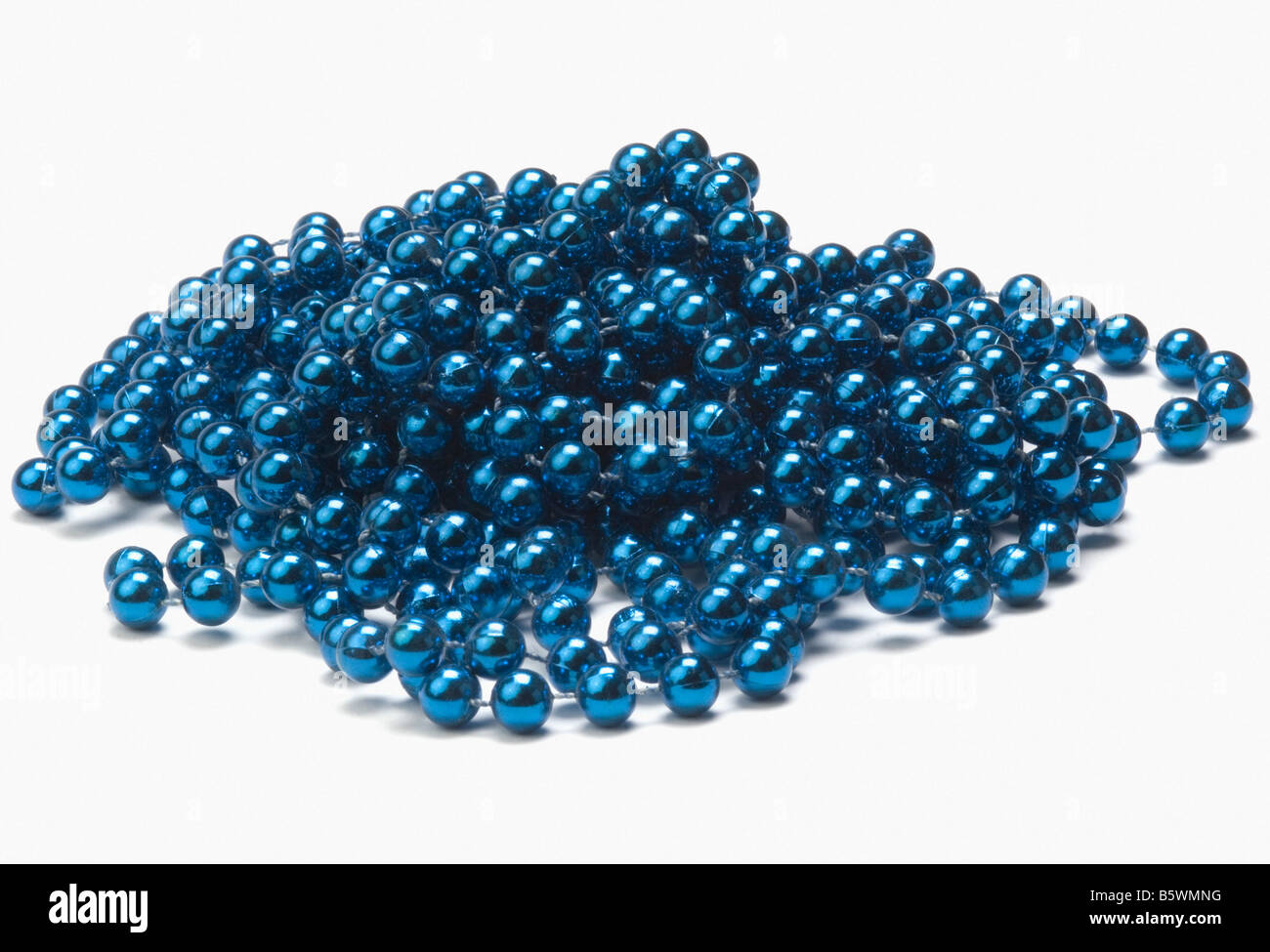 String of blue beads on white background Stock Photo - Alamy