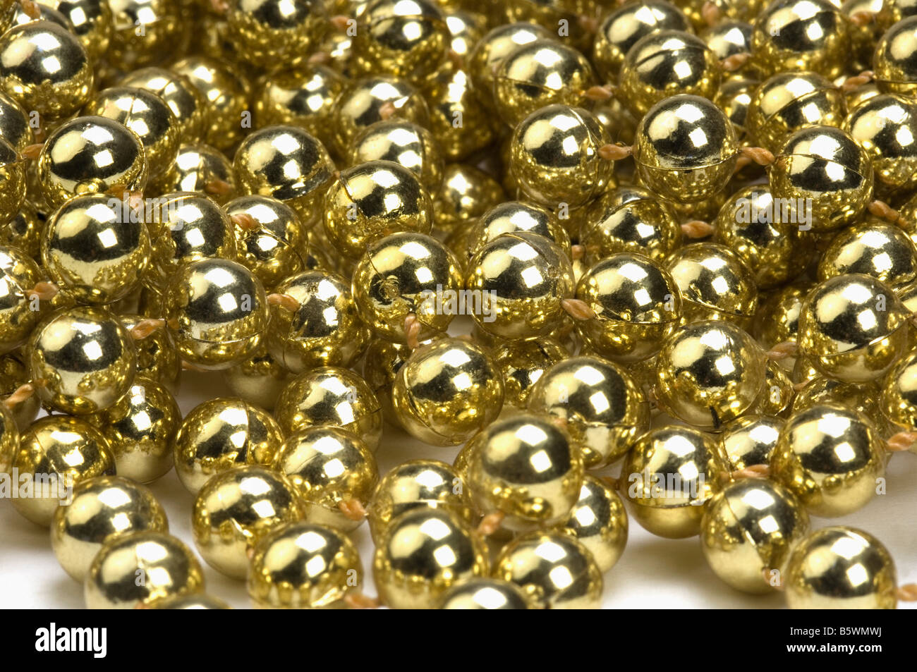 Golden bead hi-res stock photography and images - Alamy