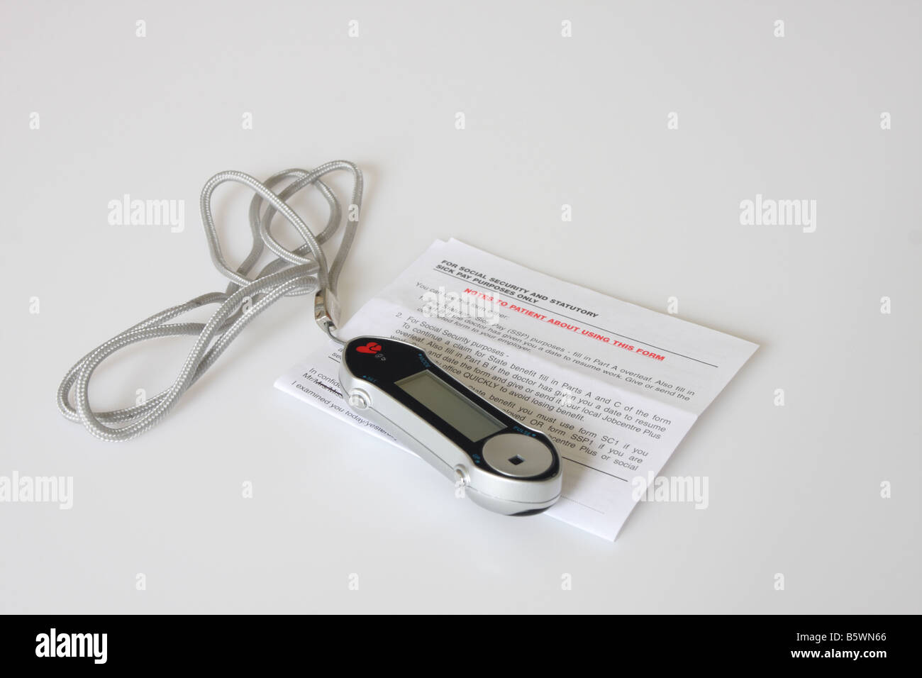Doctors Sicknote and Heart Rate (Pulse) Monitor Stock Photo - Alamy
