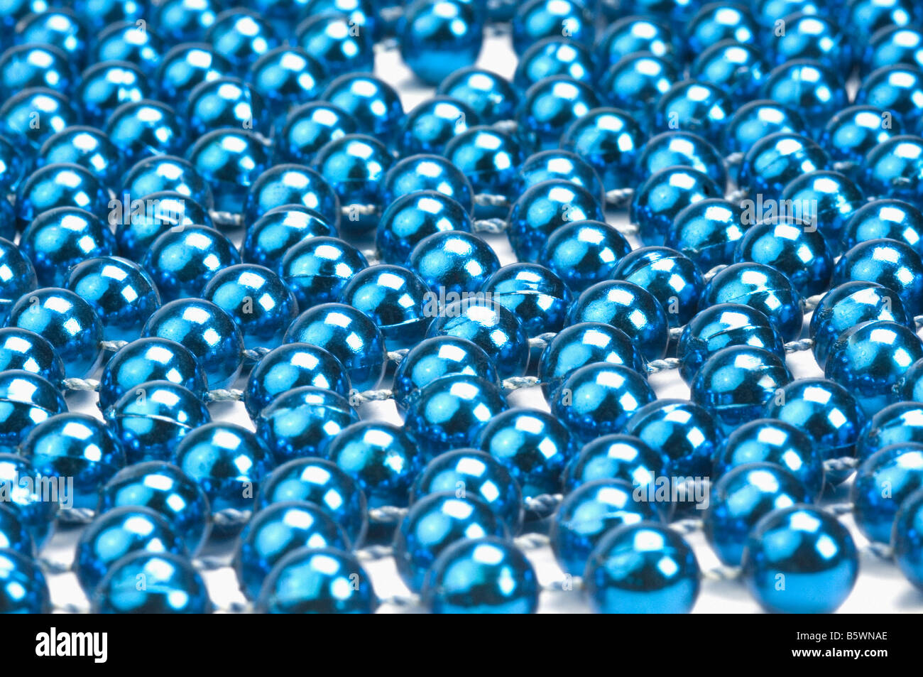 String of blue beads hi-res stock photography and images - Alamy