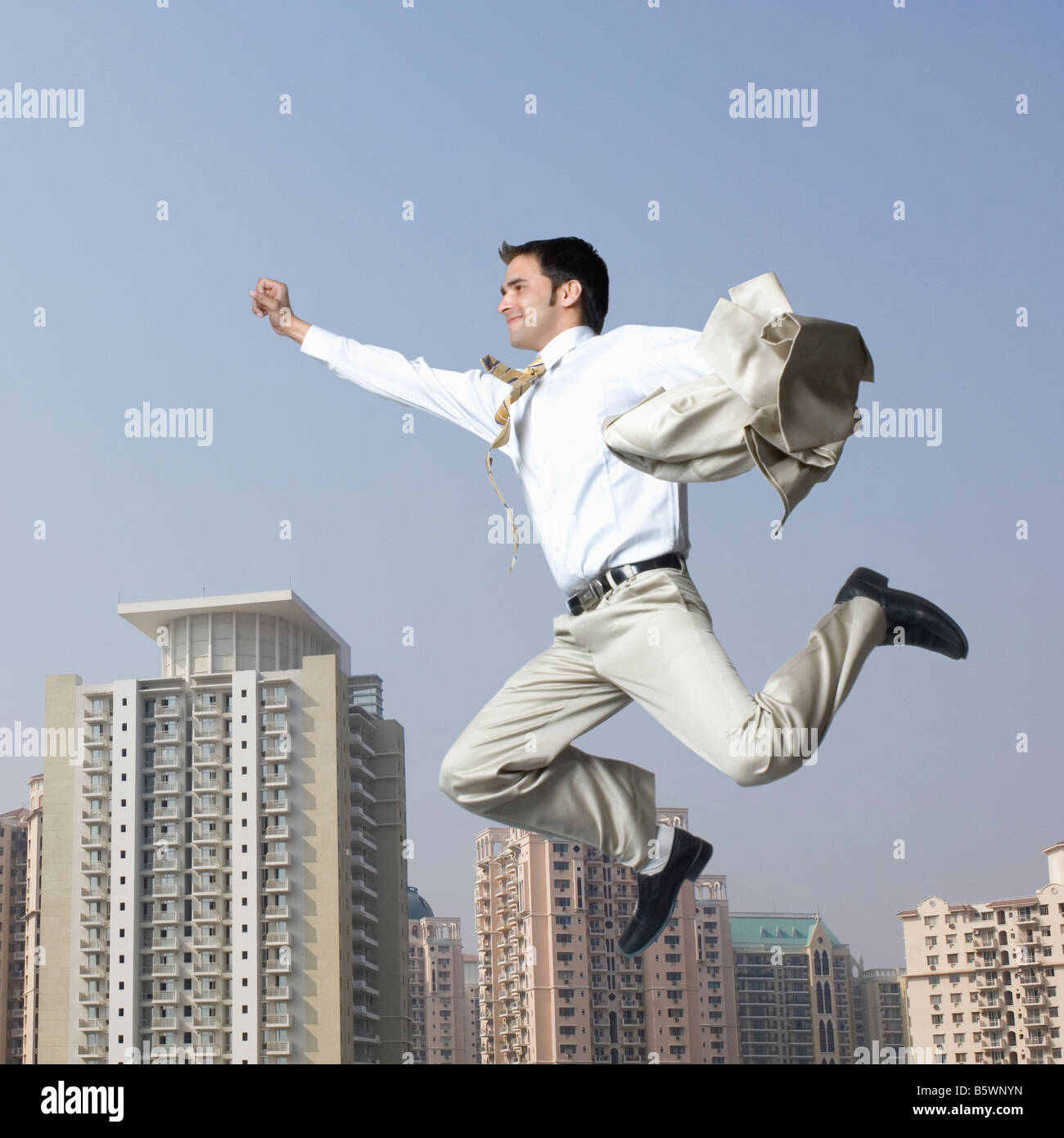 Businessman flying with his arms outstretched Stock Photo - Alamy