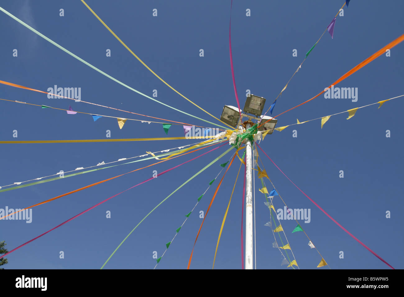 many colourful carnival flags decorations in street party outdoors in ...