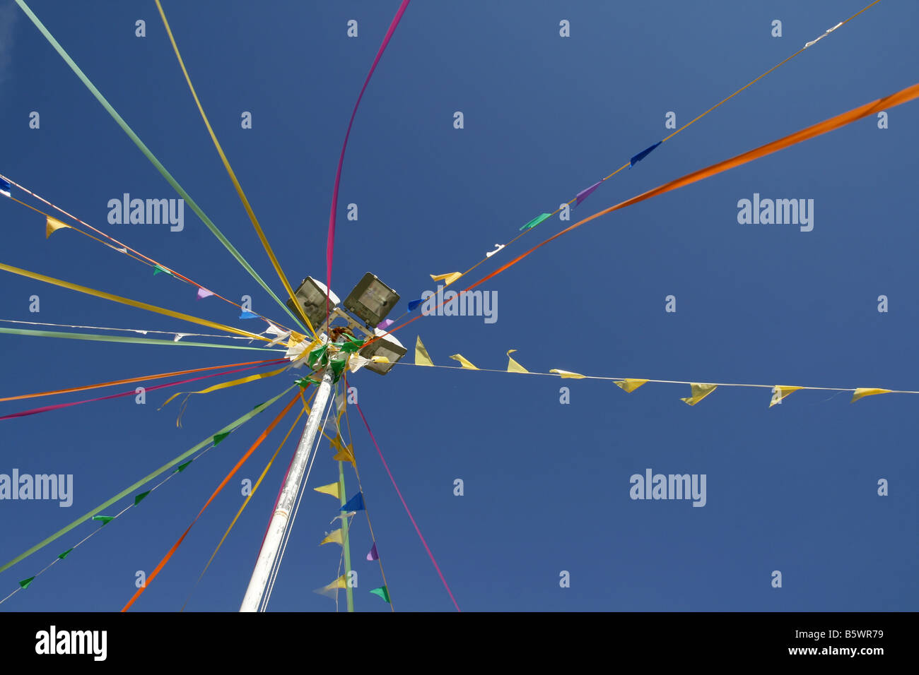 many colourful carnival flags decorations in street party outdoors in ...