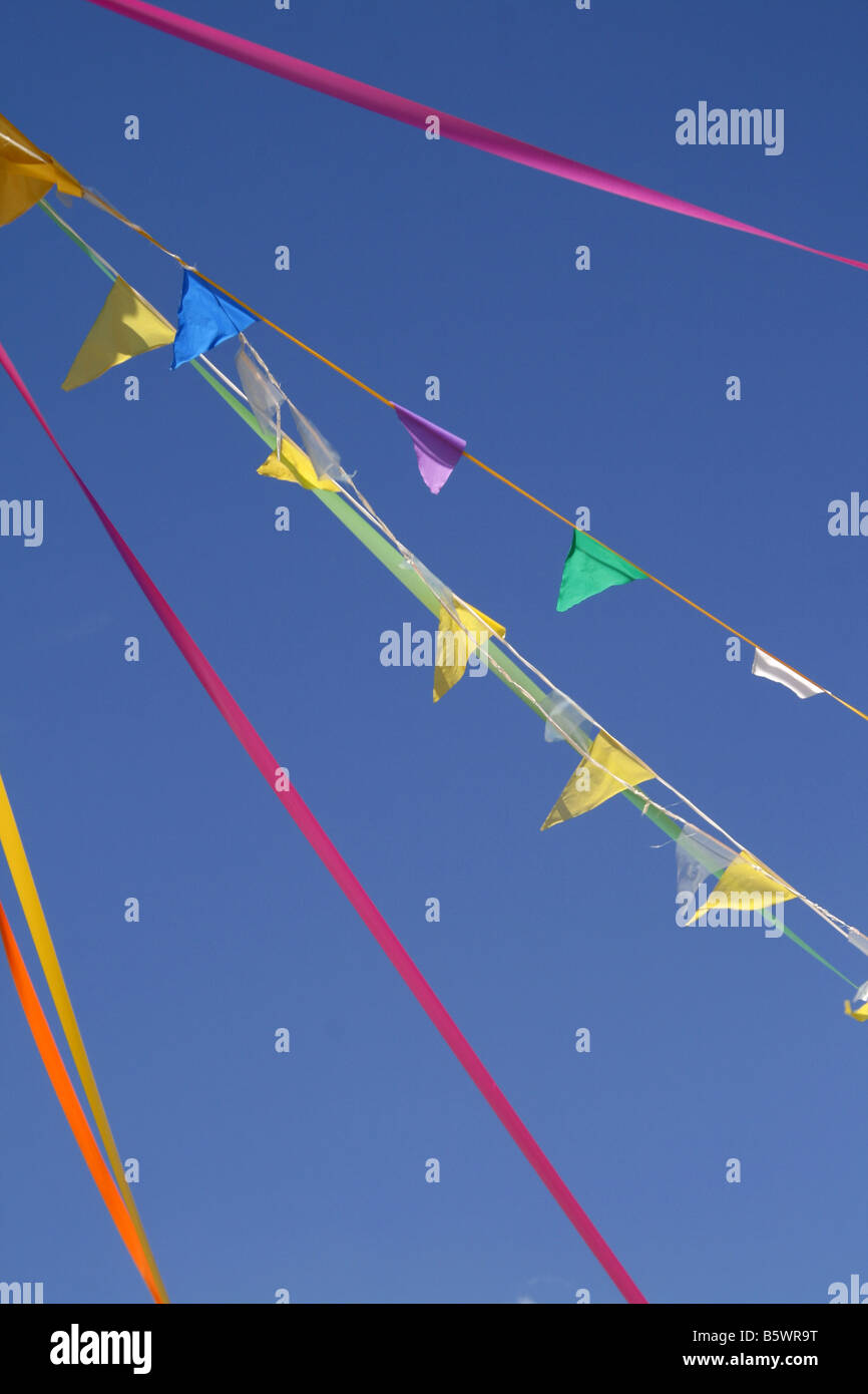 many colourful carnival flags decorations in street party outdoors in ...