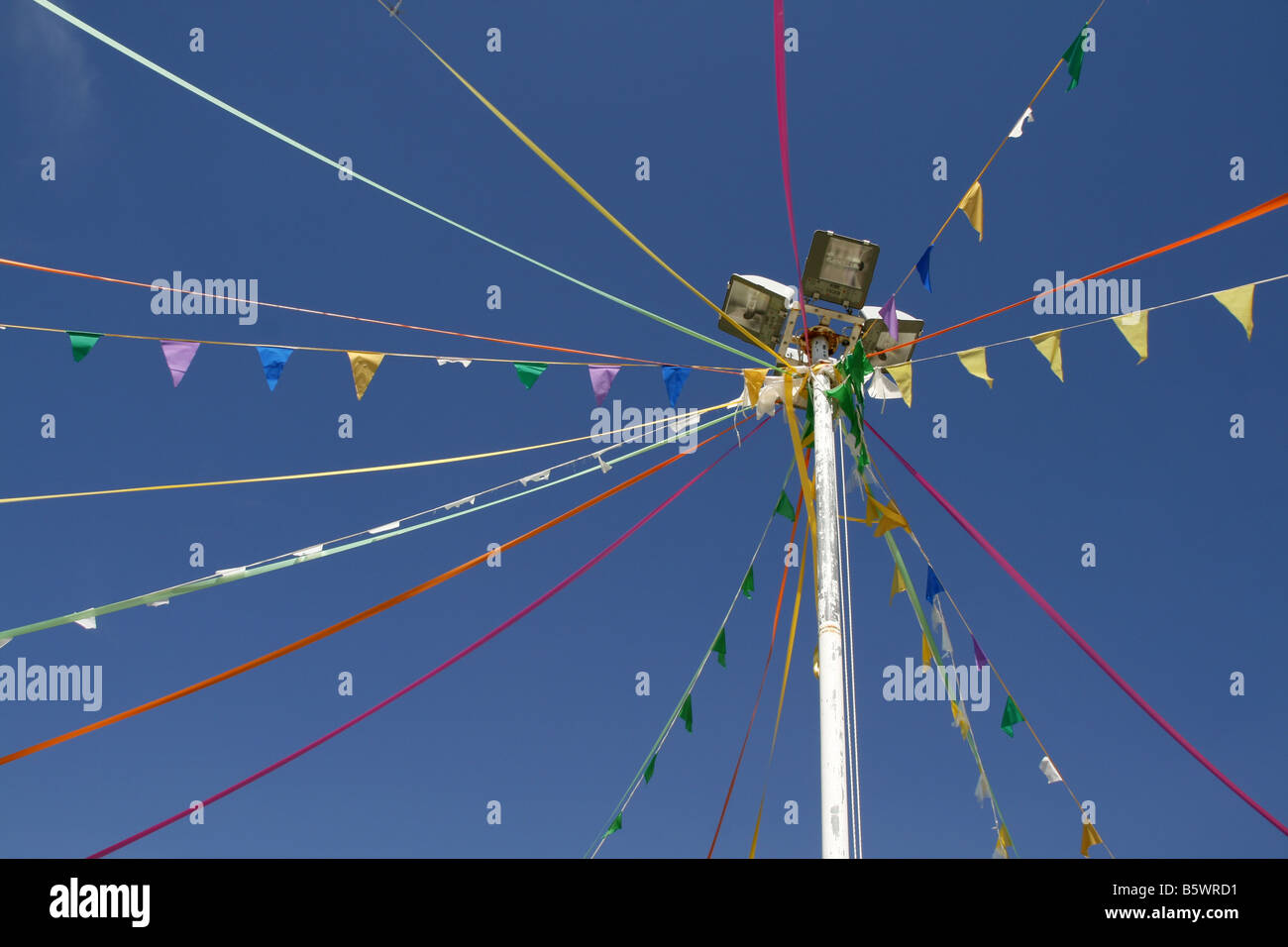 many colourful carnival flags decorations in street party outdoors in ...